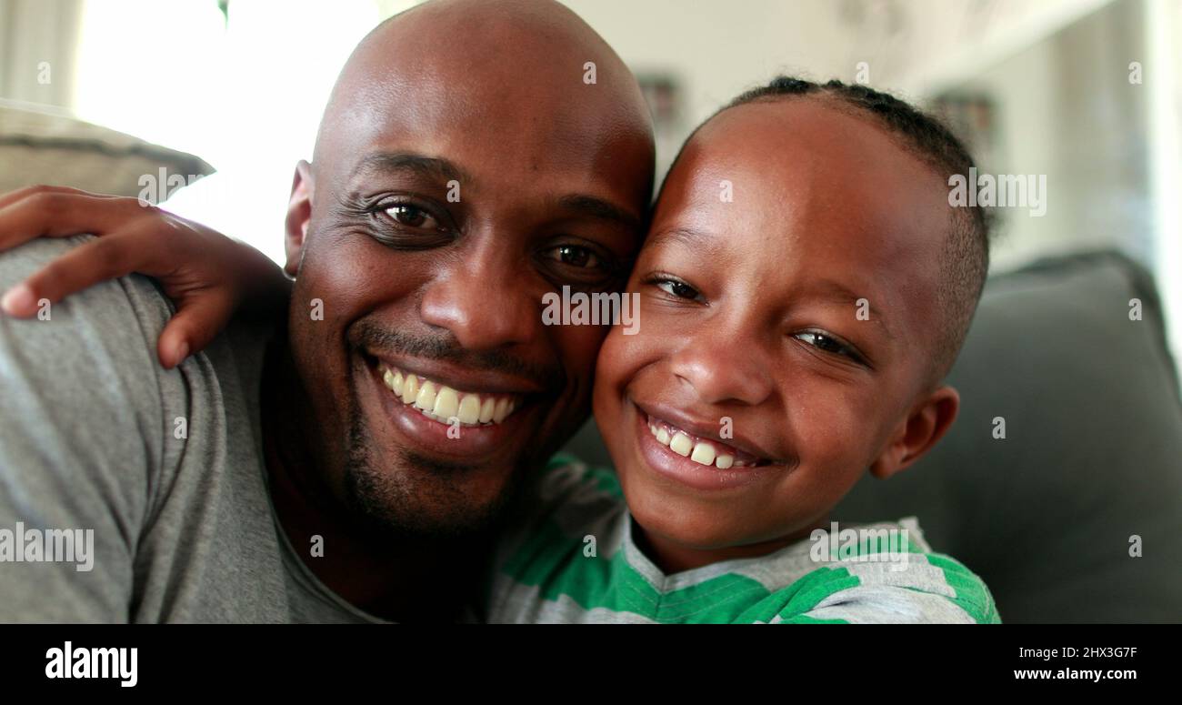 Black father and boy posing to camera. African child bonding Stock ...
