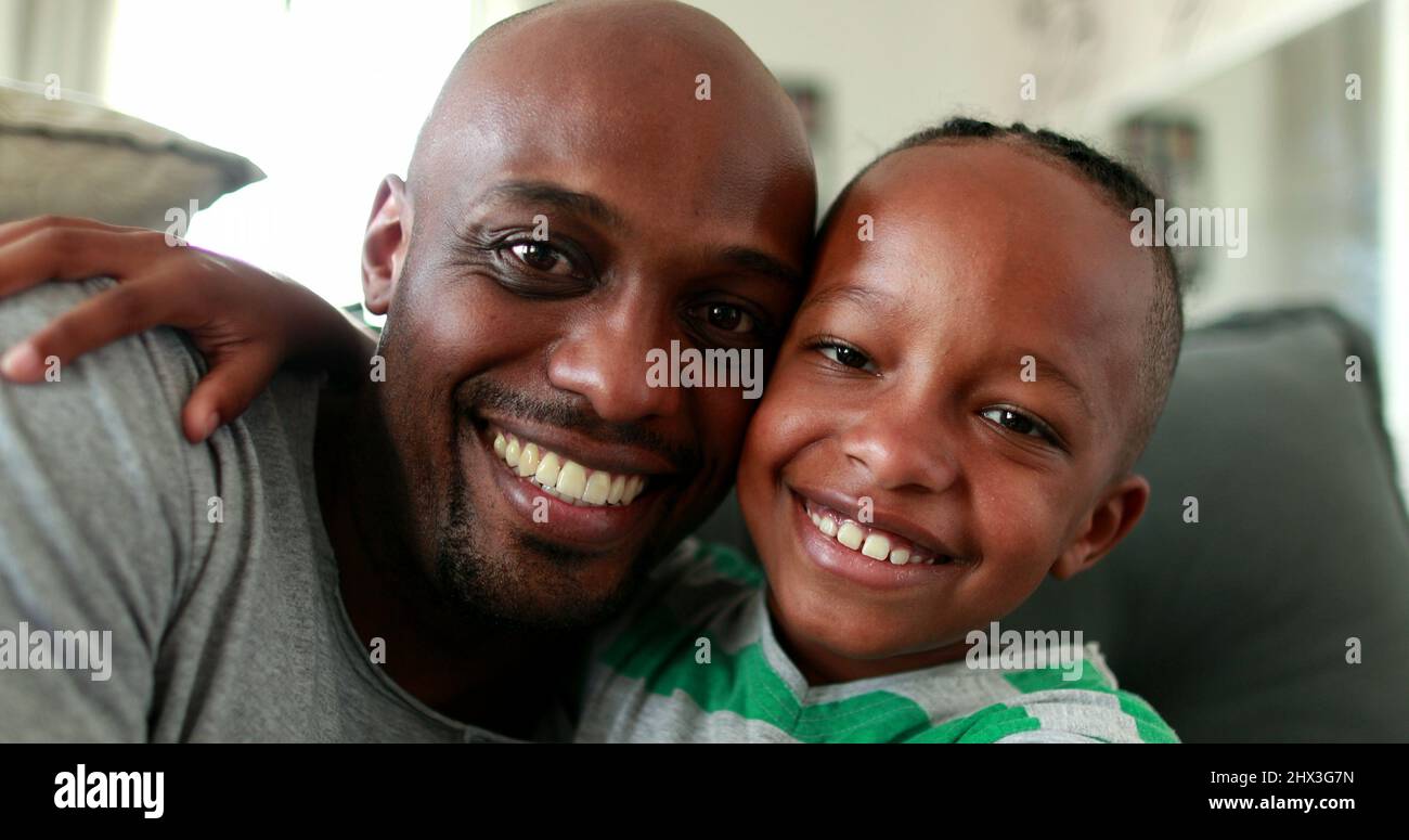 Black father and boy posing to camera. African child bonding Stock ...