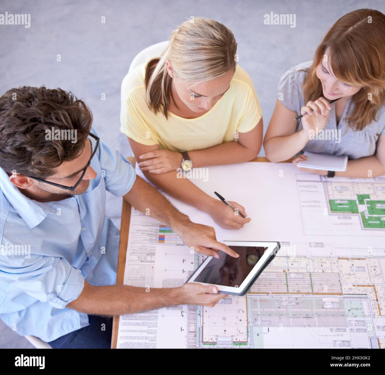 This will help us find the answers we need. Shot of a group of young ...
