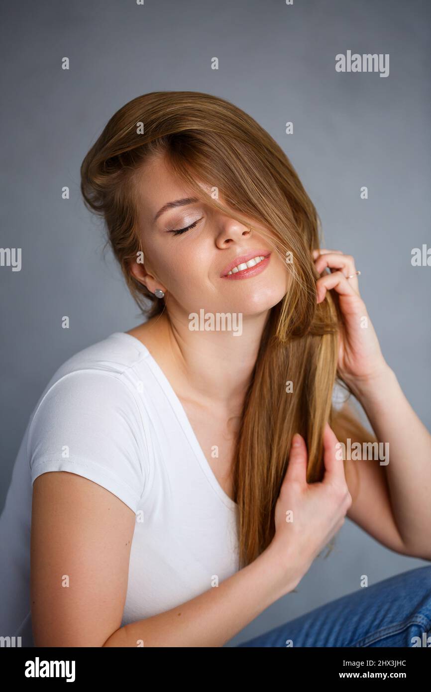 Portrait of a young beautiful woman with blond hair of European ...