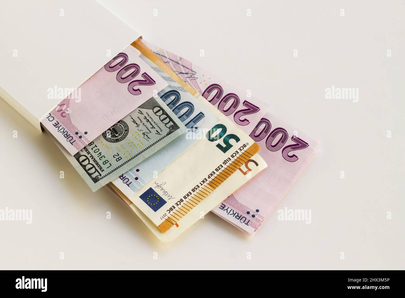 Turkish banknotes in a cardboard thin box with euro and Us dollars on ...