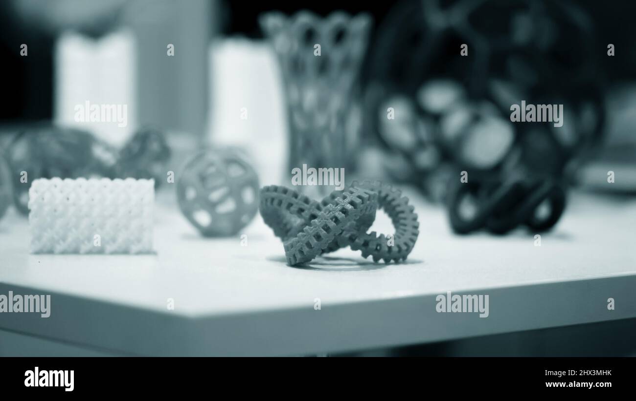 Many abstract models bright colorful objects printed on a 3d printer ...