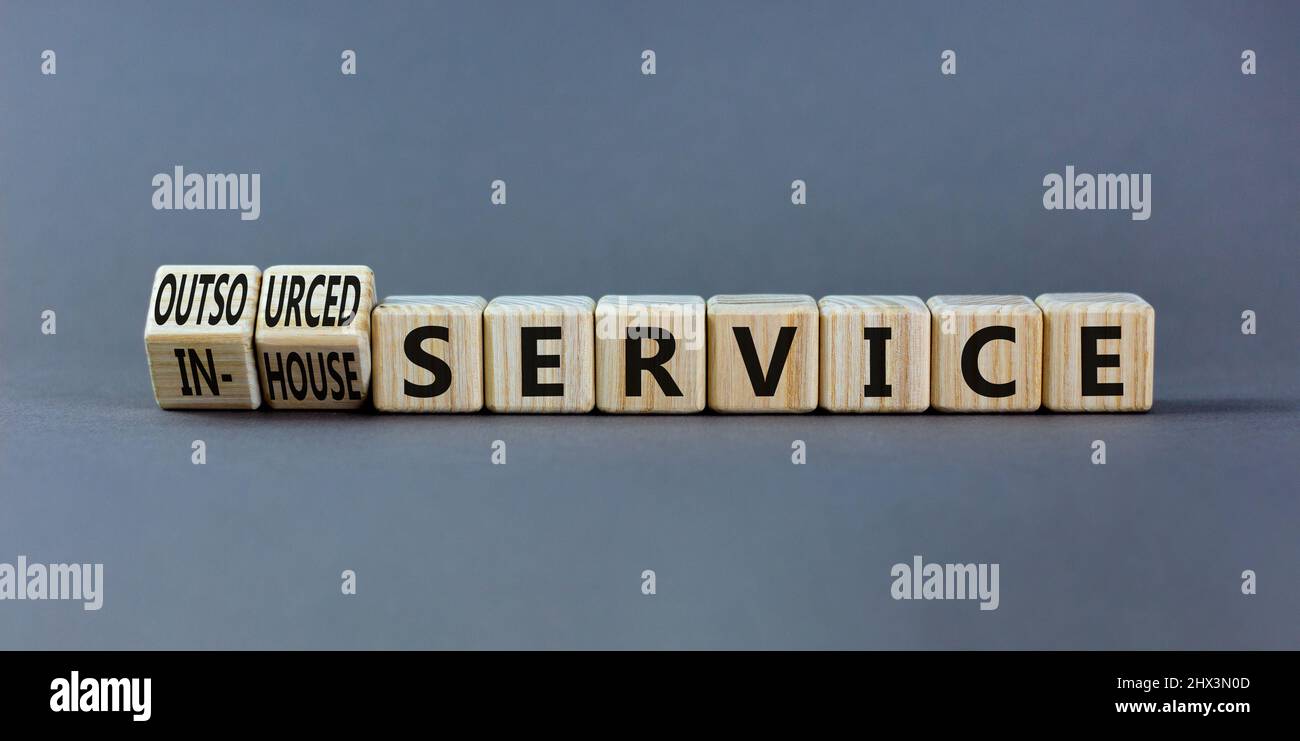 In-house or outsourced service symbol. Turned wooden cubes and changed ...