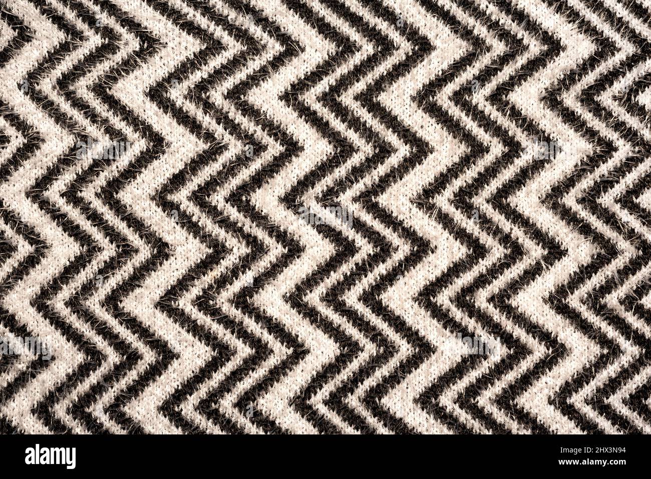 A piece of material with straight and curved lines. Cloth pattern close ...