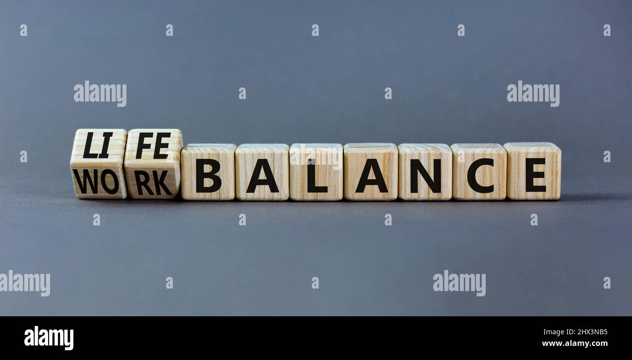 Work life balance symbol. Turned wooden cubes and changed concept words ...