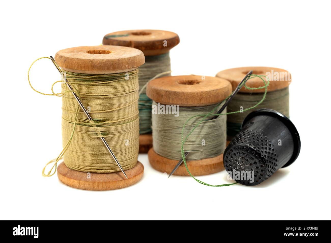 Vintage retro spool of thread on a white background. Needle with thread ...