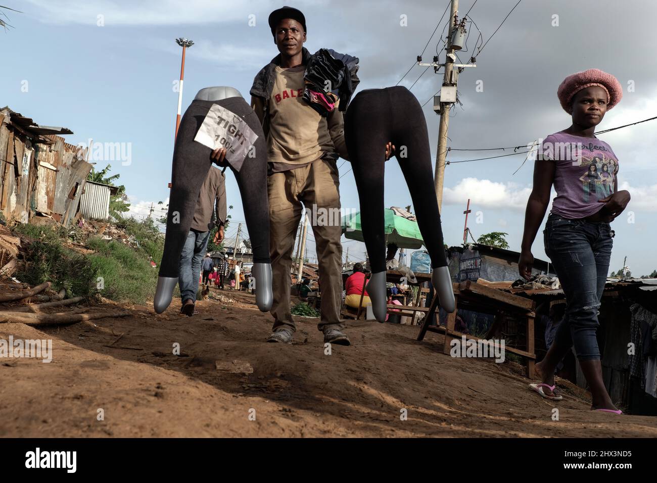 A clothes vendor sells ladies skin tights by the streets of Nairobi's ...
