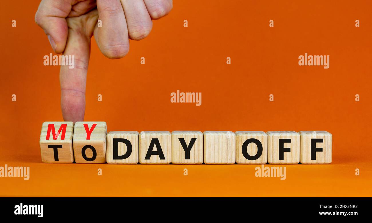 Today is my day off symbol. Businessman turns cubes and changes concept ...