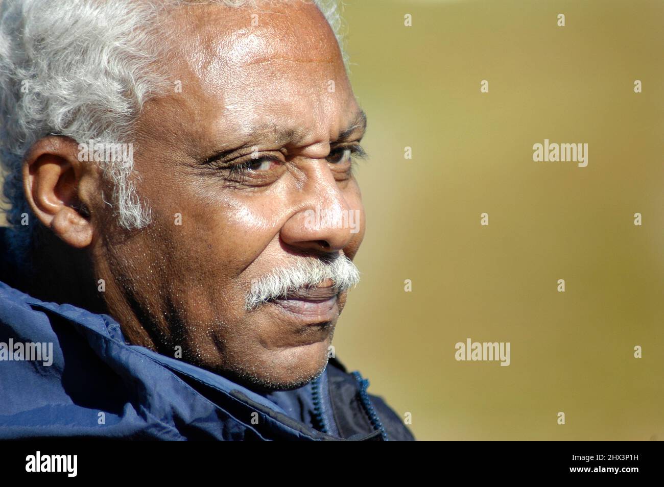Face of a happy 66 year old happy ethnic black man watching his ... Face of a happy 66 year old happy ethnic black man watching his ...