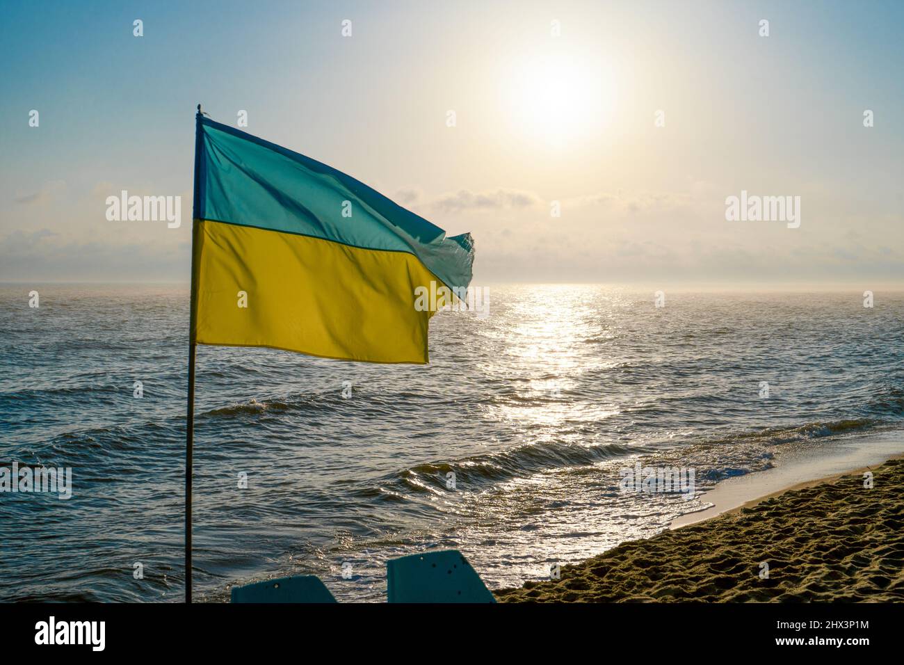 The yellow blue flag of Ukraine flutters against the sky. Symbol of ...
