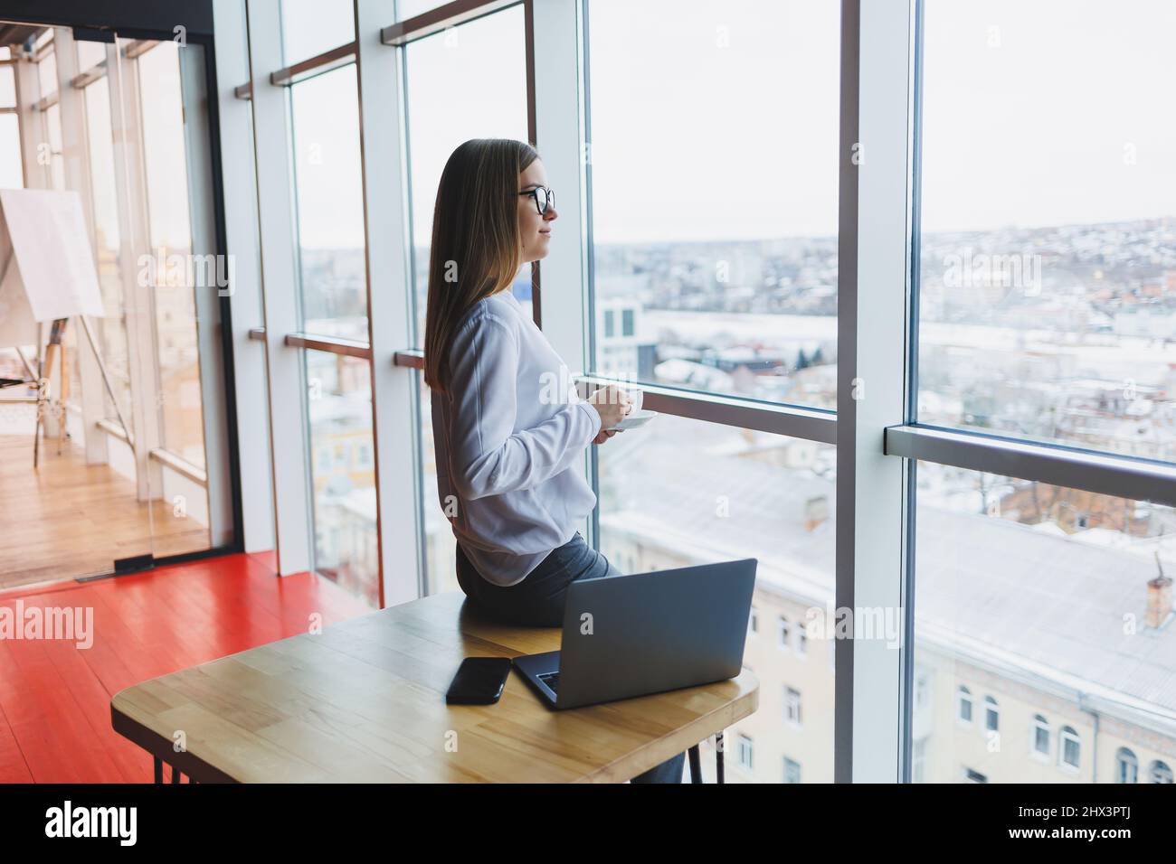 European business woman using a laptop computer while working. The ...