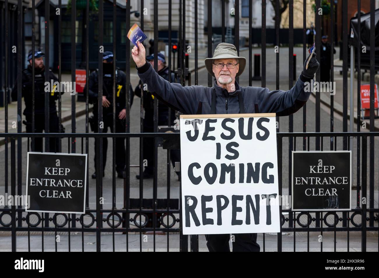 London, UK. 9 March 2022. A man carrying a religious sign bearing the ...