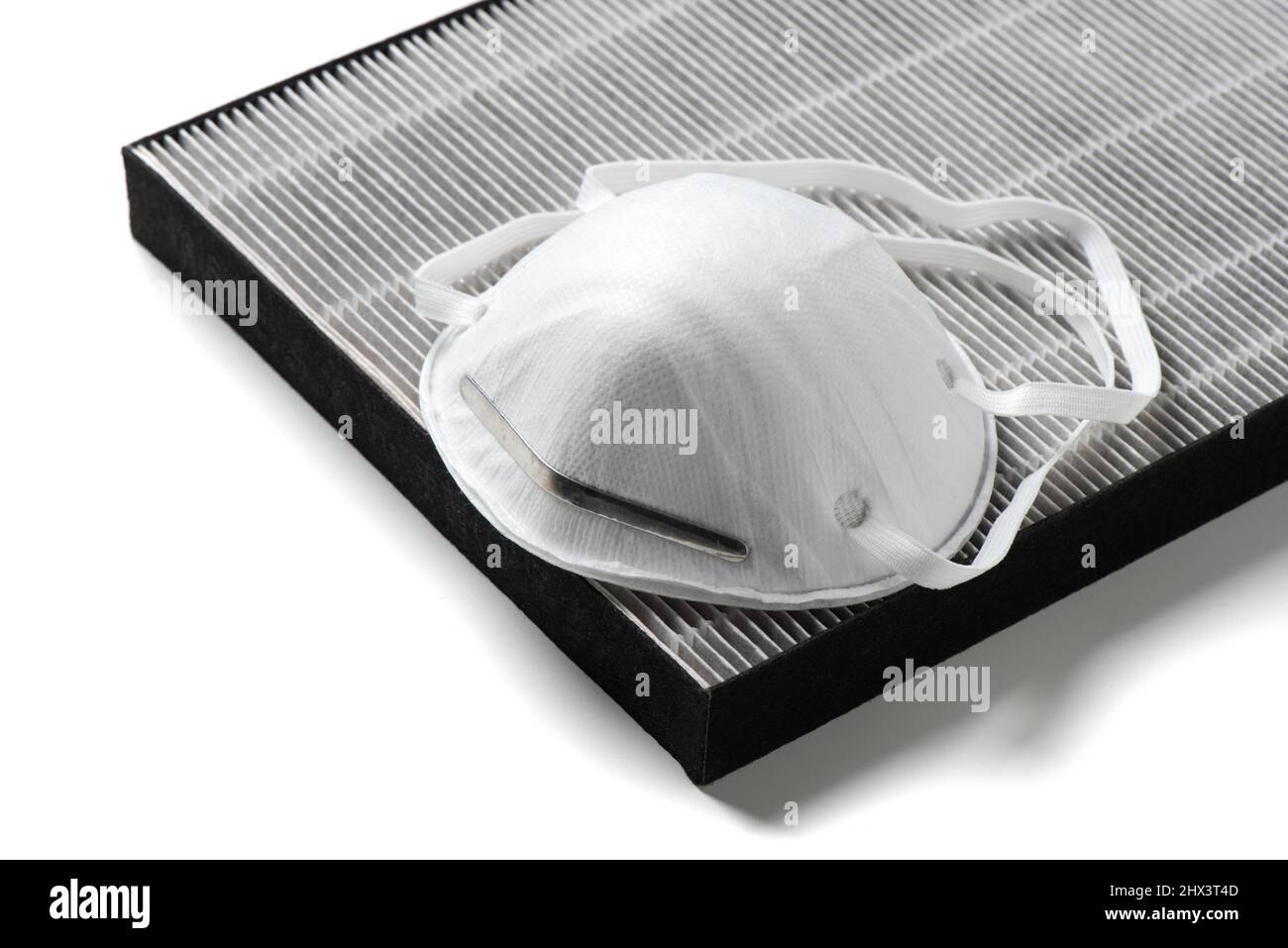 A half face dust mask and HEPA filter over white background Stock Photo ...
