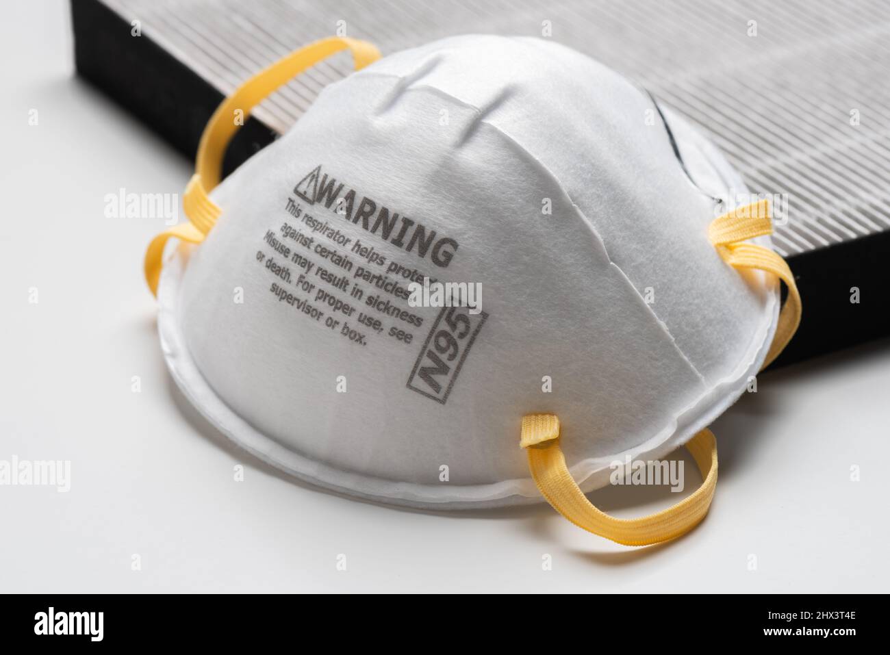 A half face dust mask and HEPA filter over white background Stock Photo ...