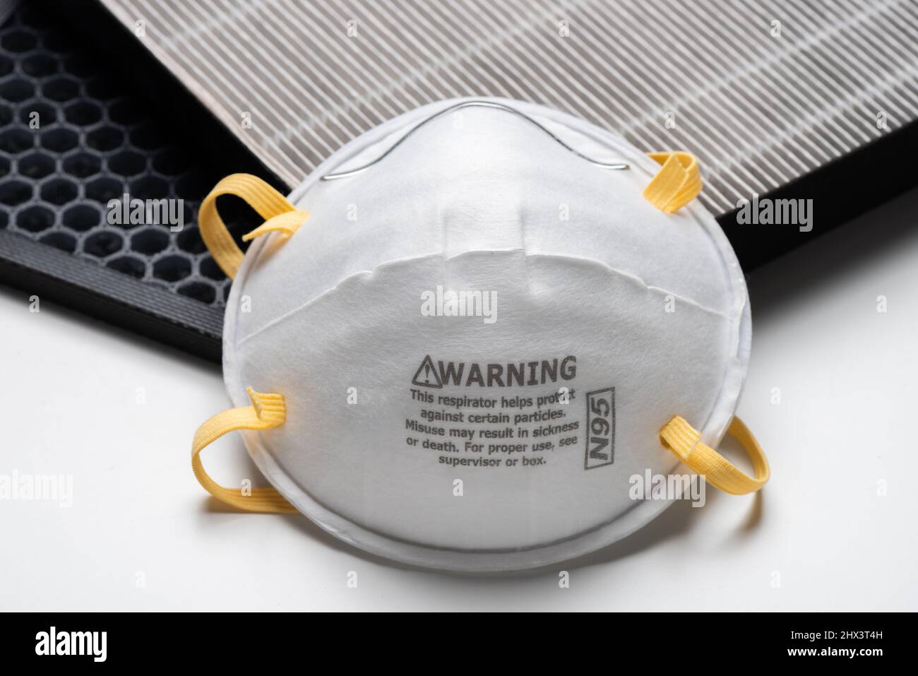 A half face dust mask and HEPA filter over white background Stock Photo ...