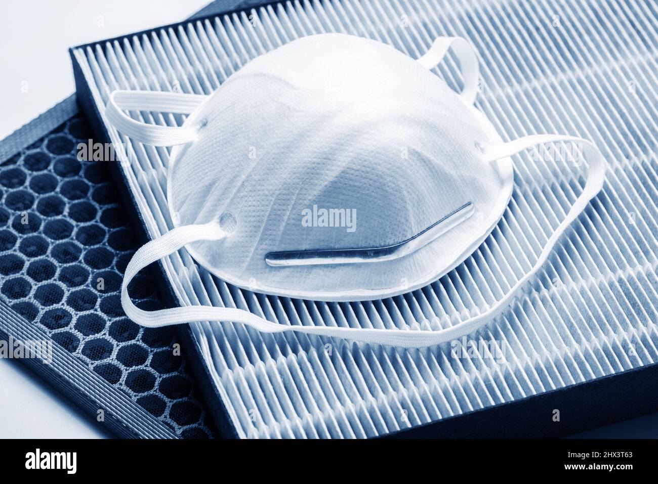 A half face dust mask and HEPA filter over white background Stock Photo ...