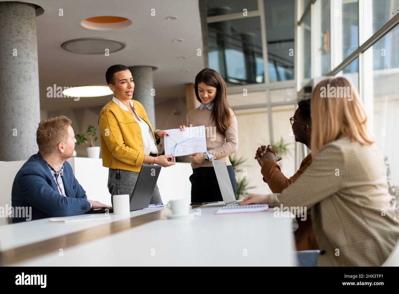 Group of young multiethnic business people working together and ...