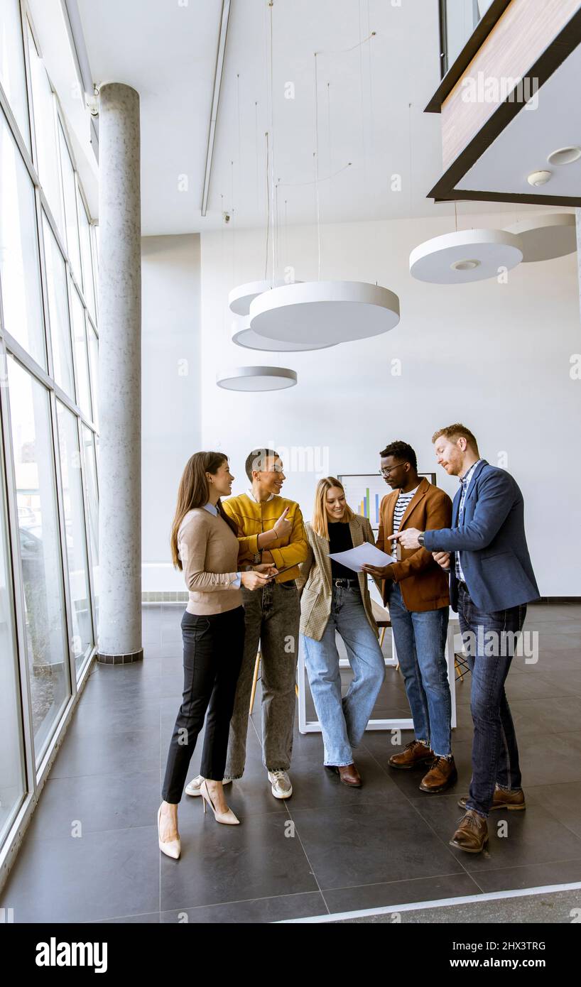 Young creative team working together in the modern office Stock Photo ...