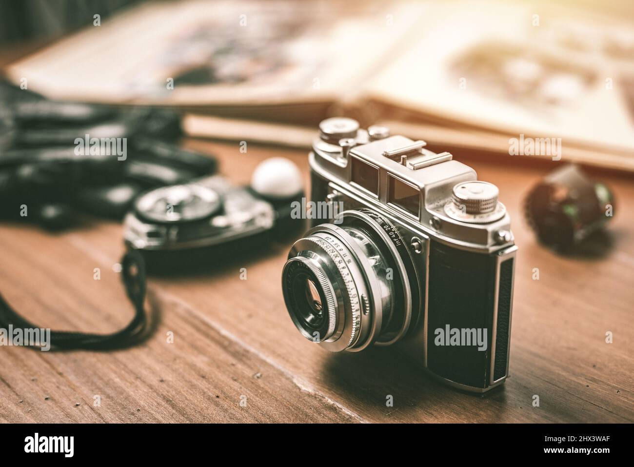 Old film camera with film and light meter Stock Photo - Alamy