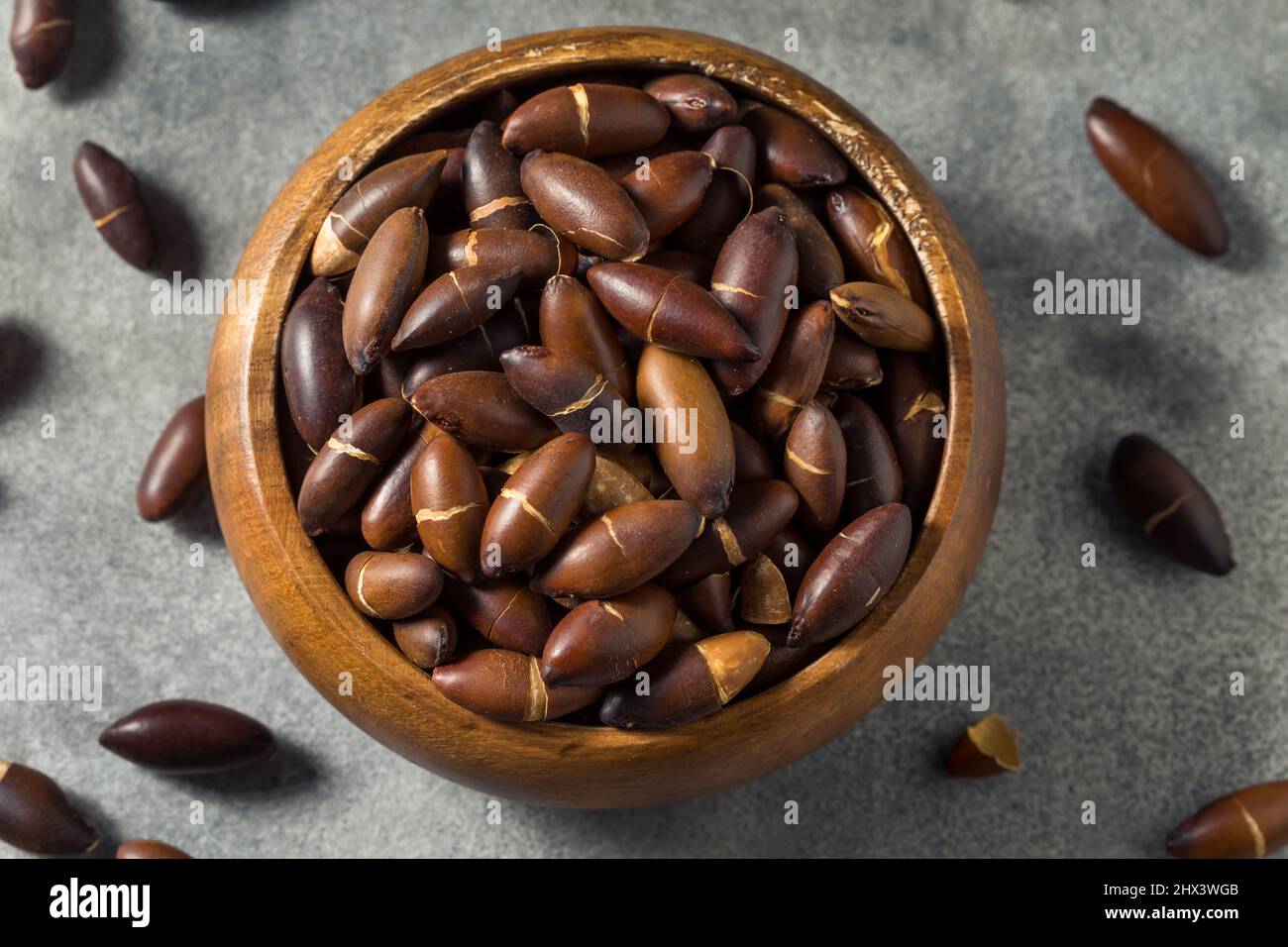 Raw Brown Organic Brazilian Baru Nuts in a Bowl Stock Photo - Alamy