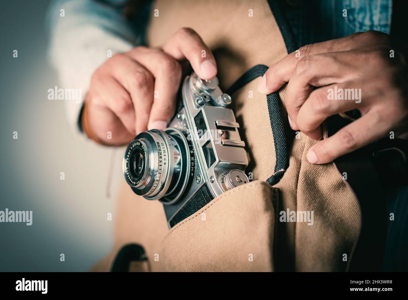 Old film camera in man's hand. Photography and hobby concept Stock ...