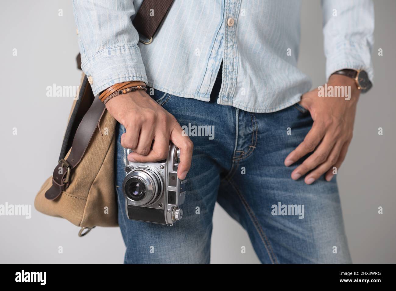 Old film camera in man's hand. Photography and hobby concept Stock ...