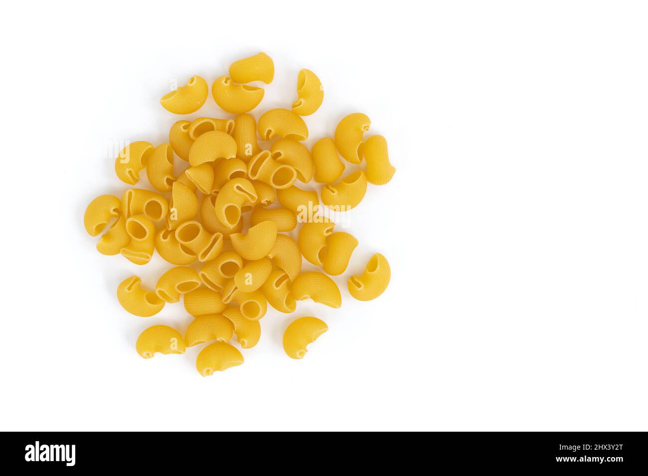heap of pipe rigate pasta with empty space for text isolated on white ...