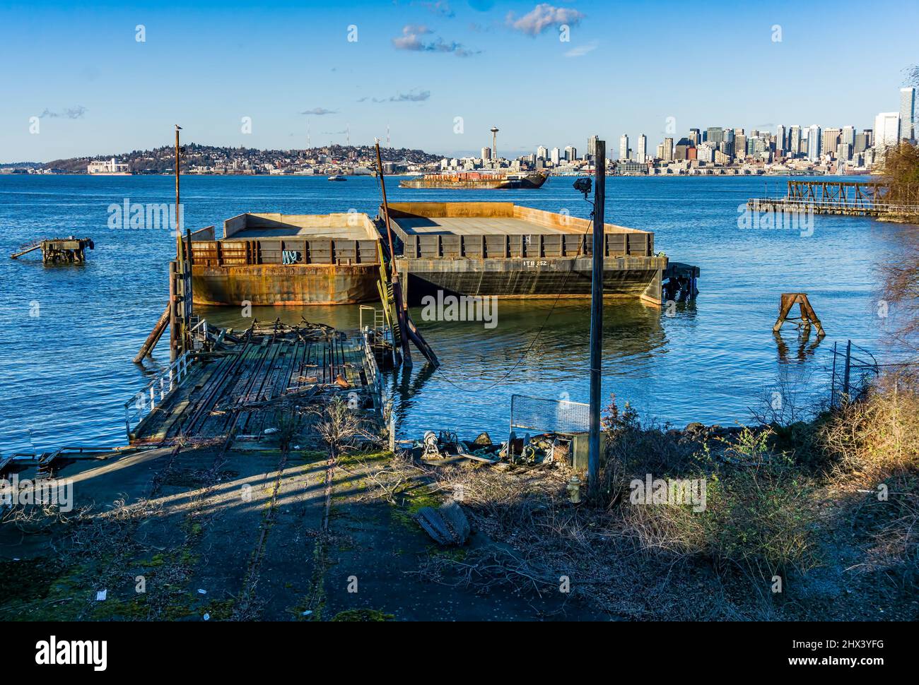 Old pier and barge in West Seattle, Washington Stock Photo - Alamy