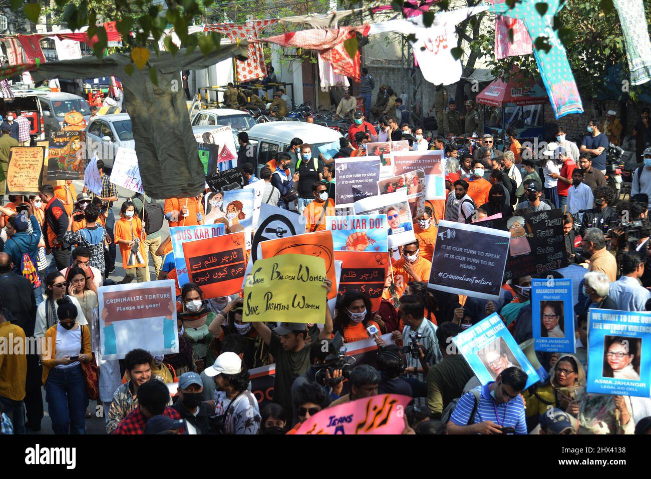 Pakistani Aurat March activists hold placards and shout slogans as they ...