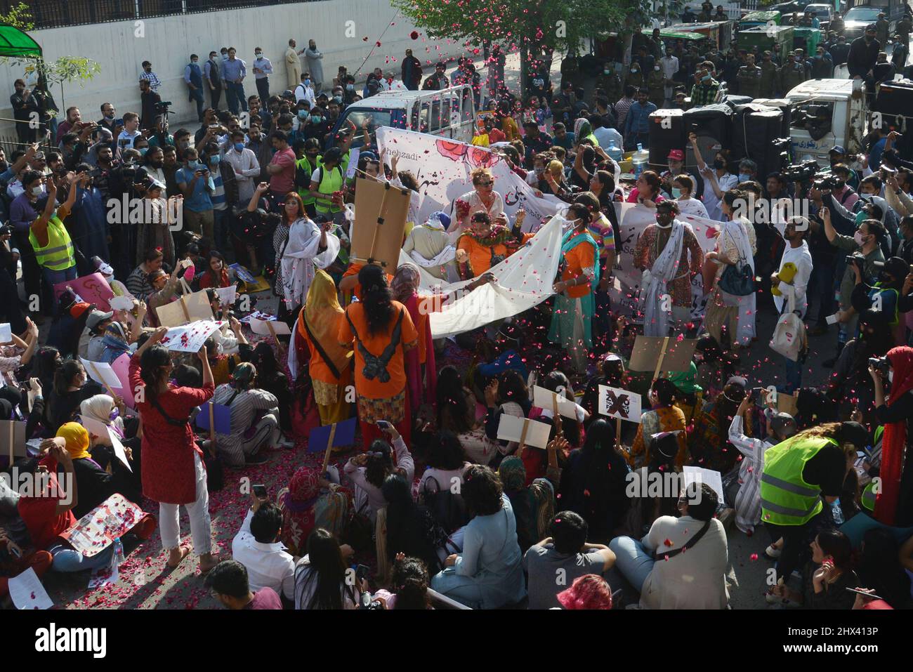 Pakistani Aurat March activists hold placards and shout slogans as they ...