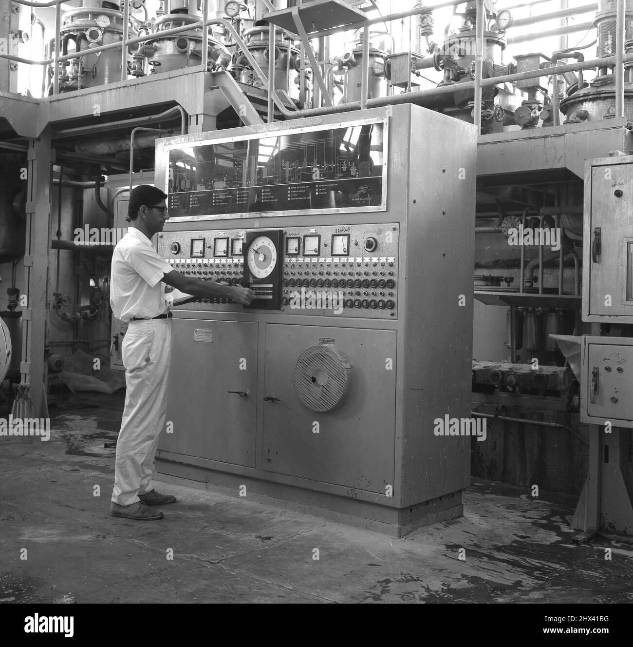 1960s, historical, an arab male operative working at a control unit ...