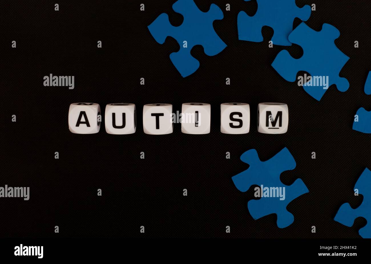 Autism awareness, autism spelled in letter dice with puzzle pieces ...