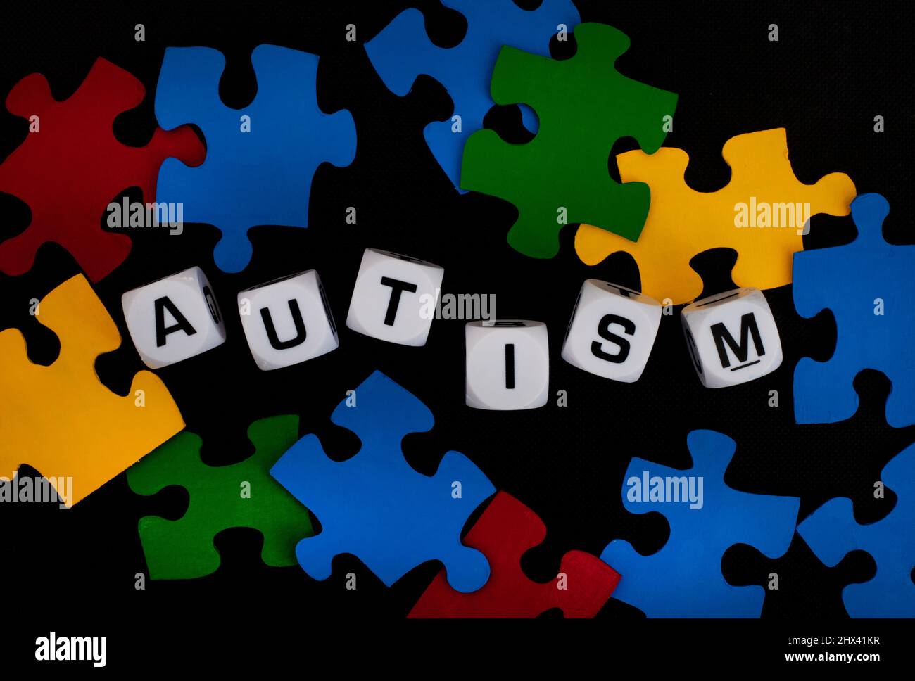 Autism awareness, autism spelled in letter dice with puzzle pieces ...