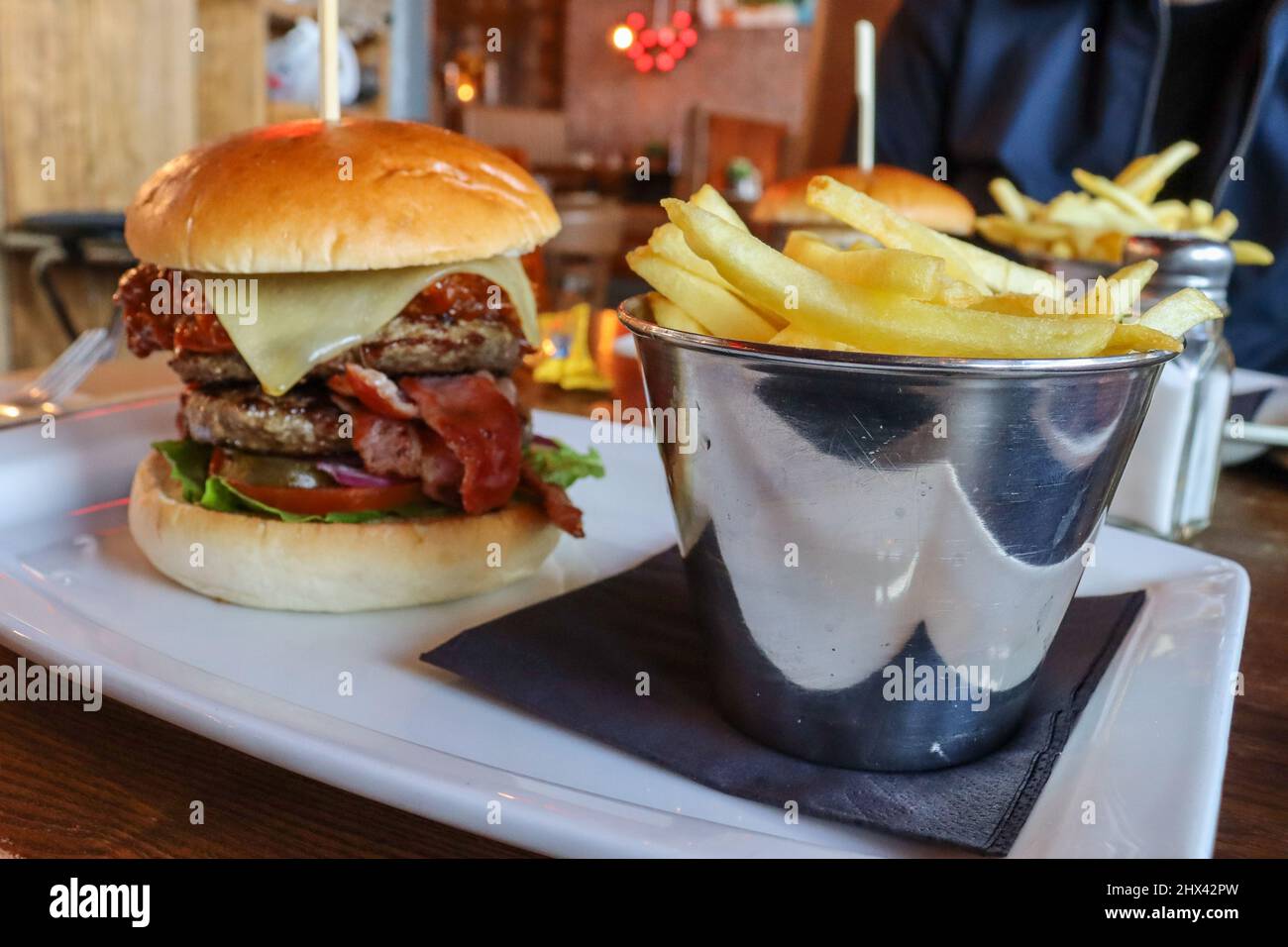 Gourmet beef burger with bacon, cheese and fries Stock Photo - Alamy