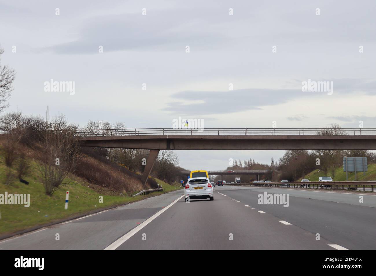 Motorway bridge with Ukraine flag flying over Stock Photo - Alamy