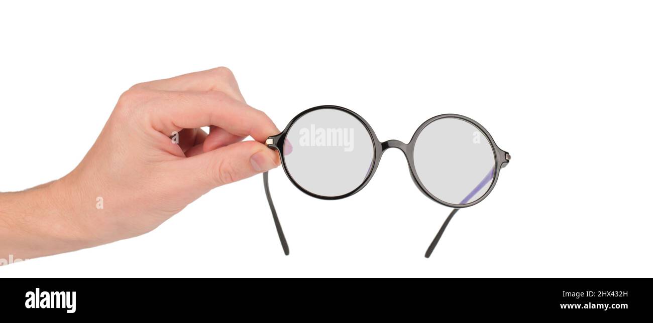 Round stylish glasses for vision in a male hand on a white background ...
