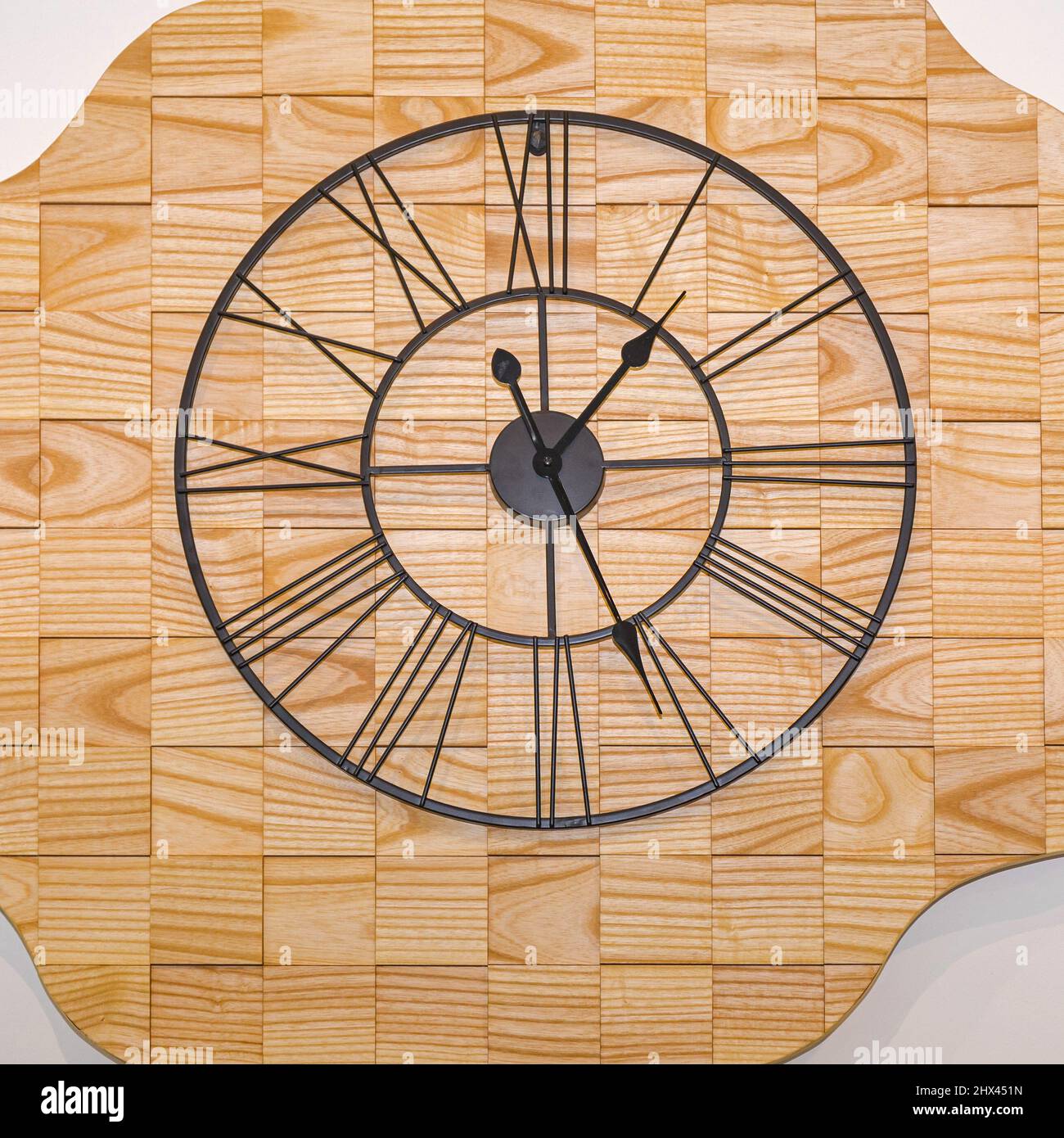 Simple Minimalistic Roman Clock at Wooden Tiles Wall Stock Photo - Alamy