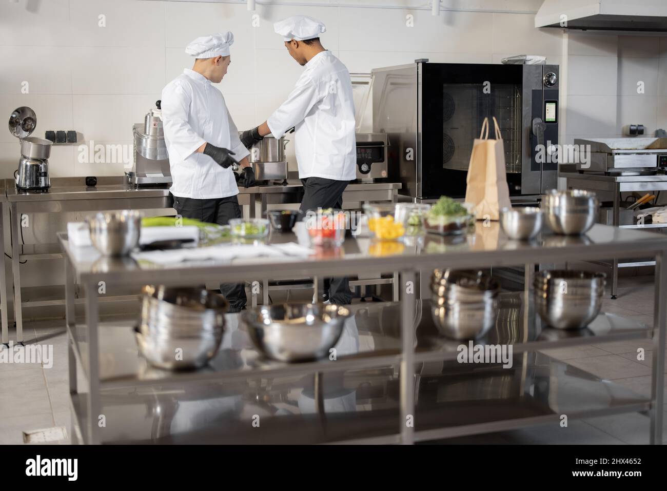Two multiethnic men working in hi-res stock photography and images - Alamy