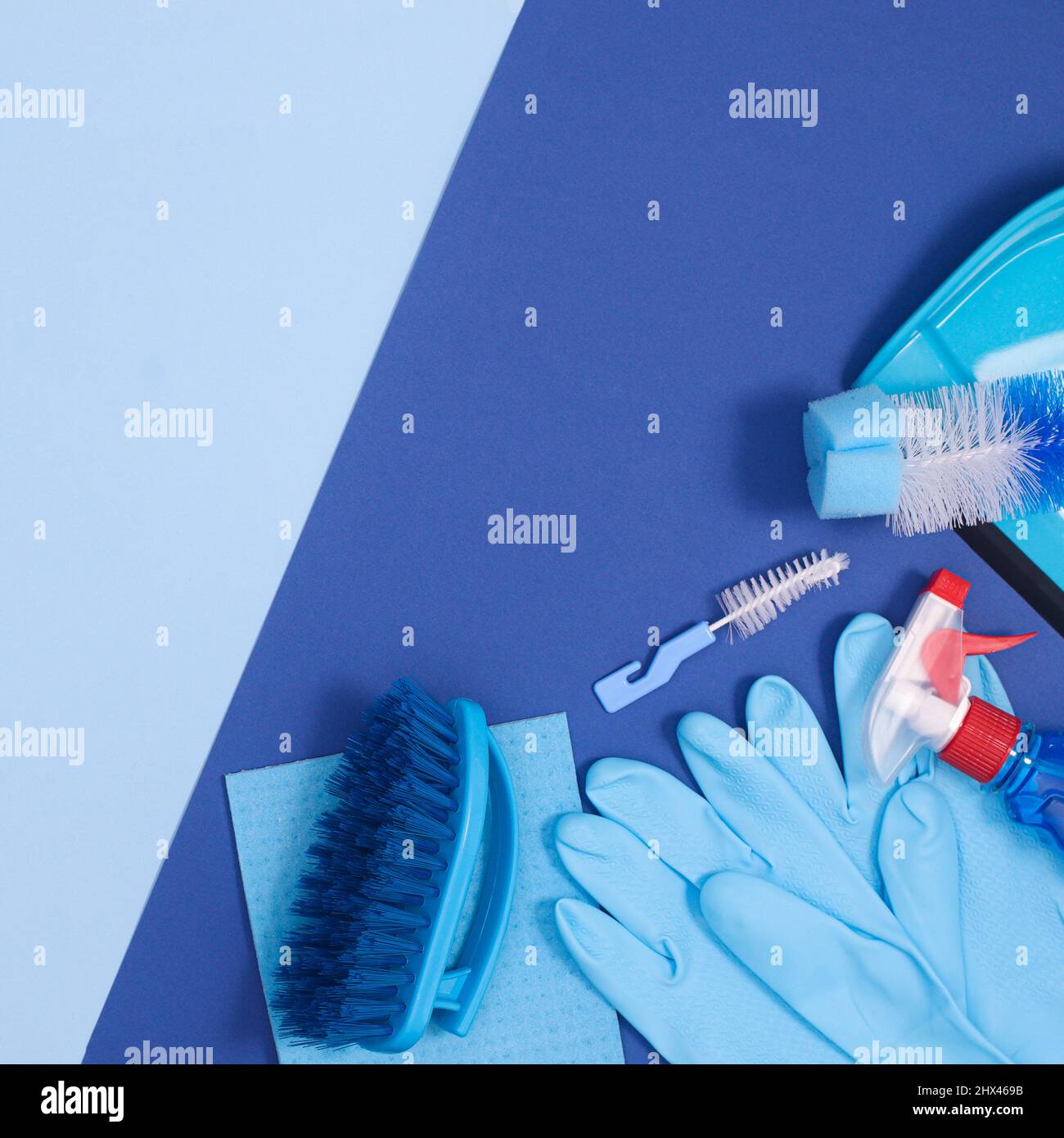 Cleaning tools on deep blue background with copy space. Flat lay Stock ...