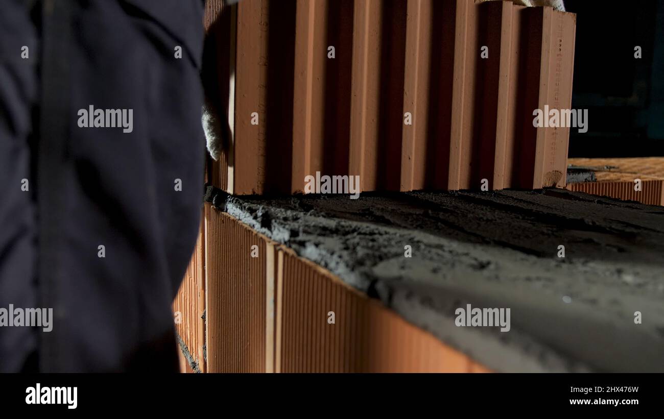 Bricklaying hands put brick on hi-res stock photography and images - Alamy