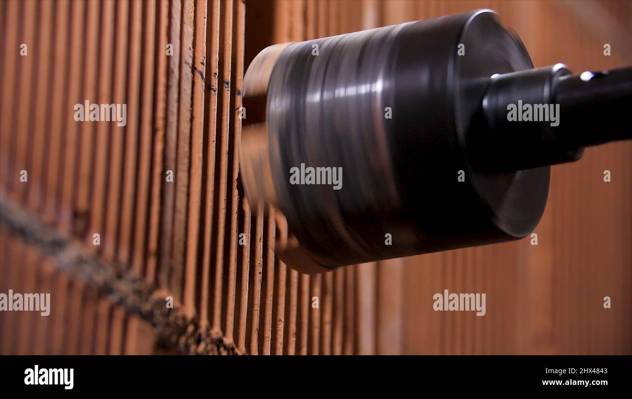 Close up of male with electric drill perforator before making a hole in ...