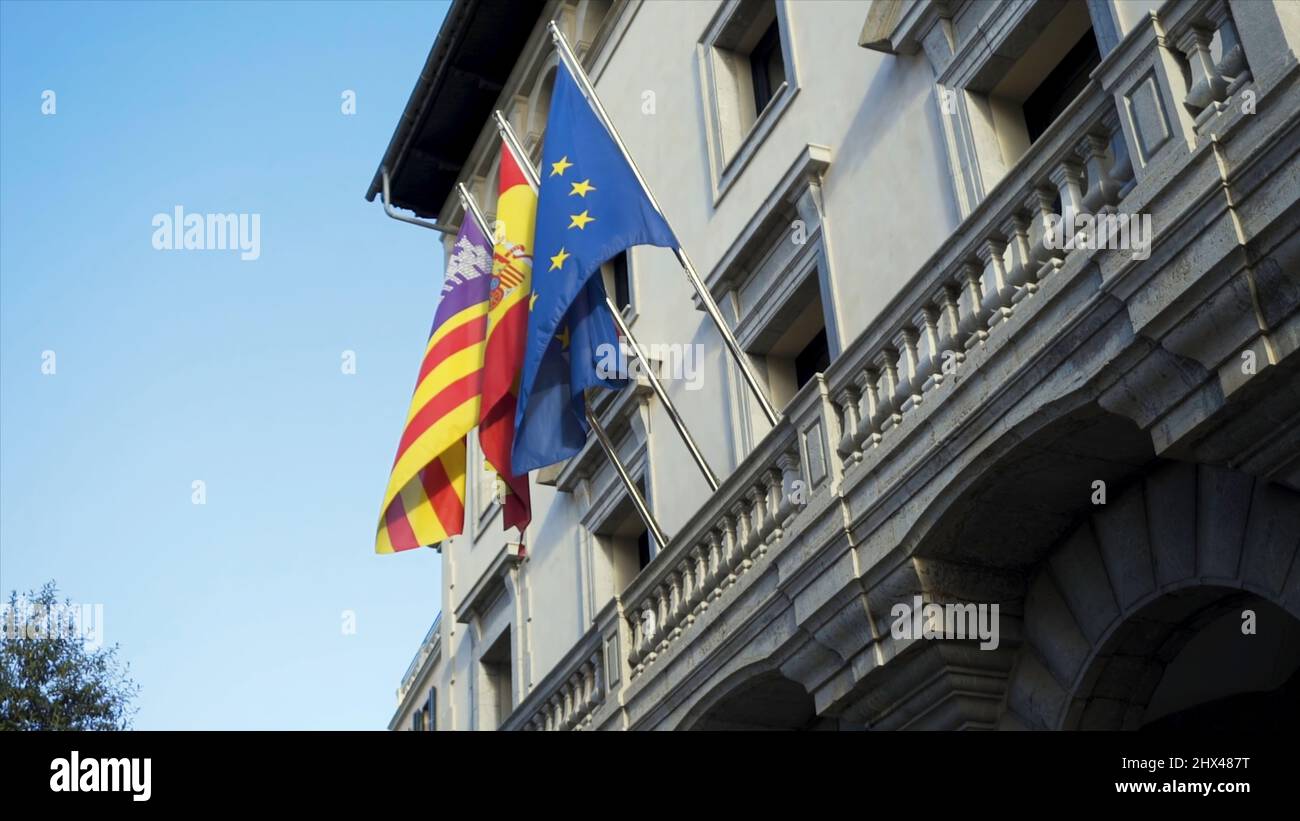 Flags of European countries on embassy house facade. Colorful banners ...