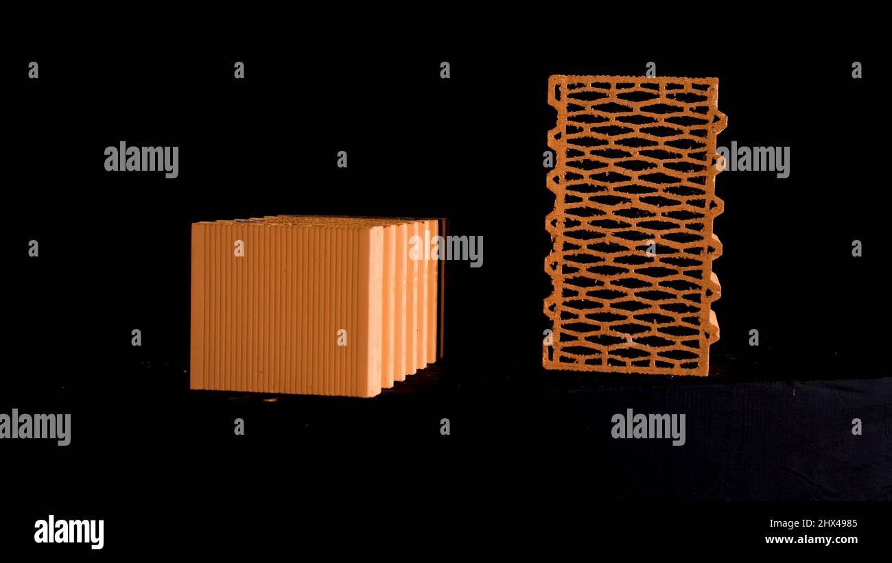 Wall construction materials, small pile of ceramic blocks isolated on ...