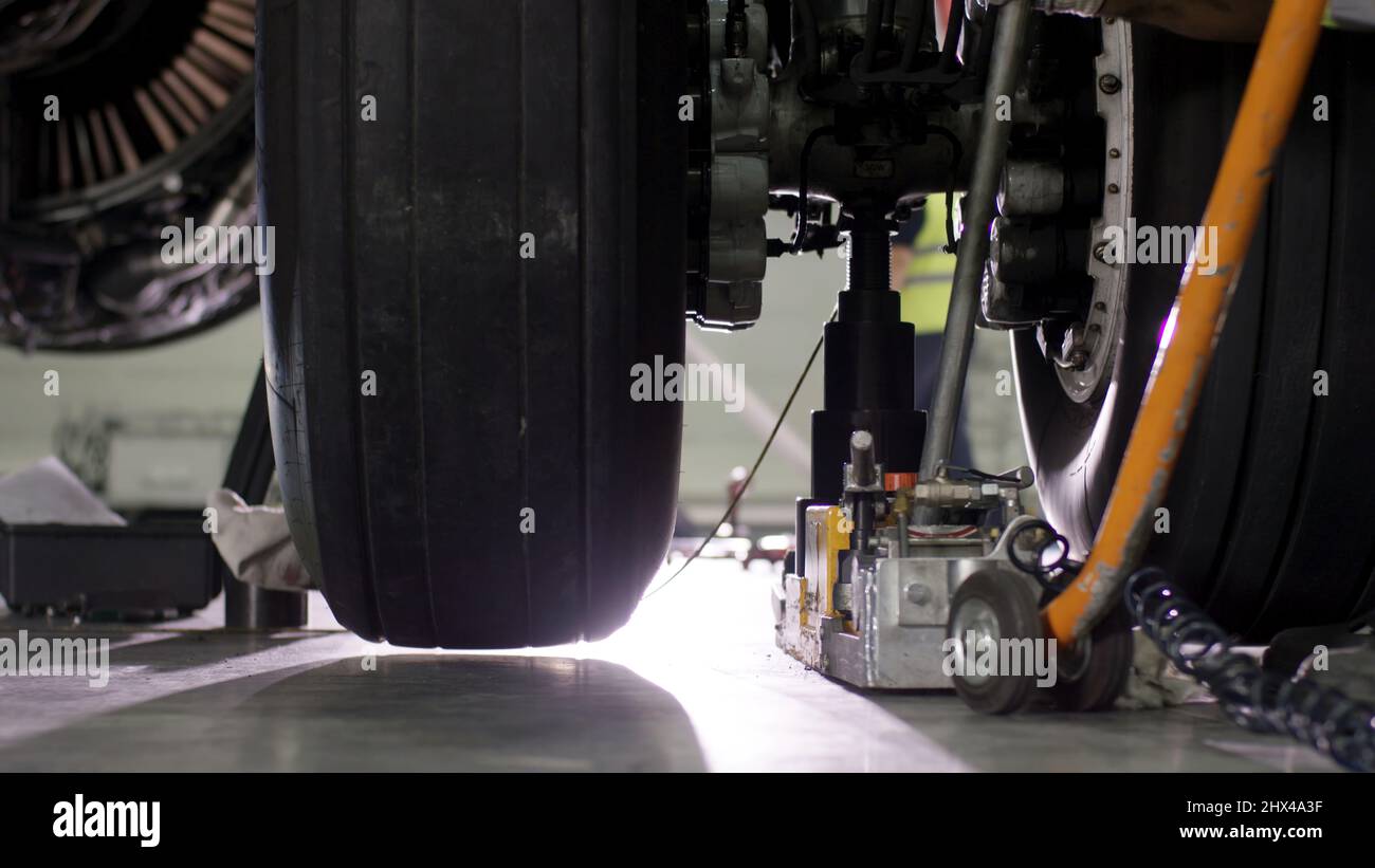 Aircraft brake repair. Close up of airplane wheel and shaft. Huge ...