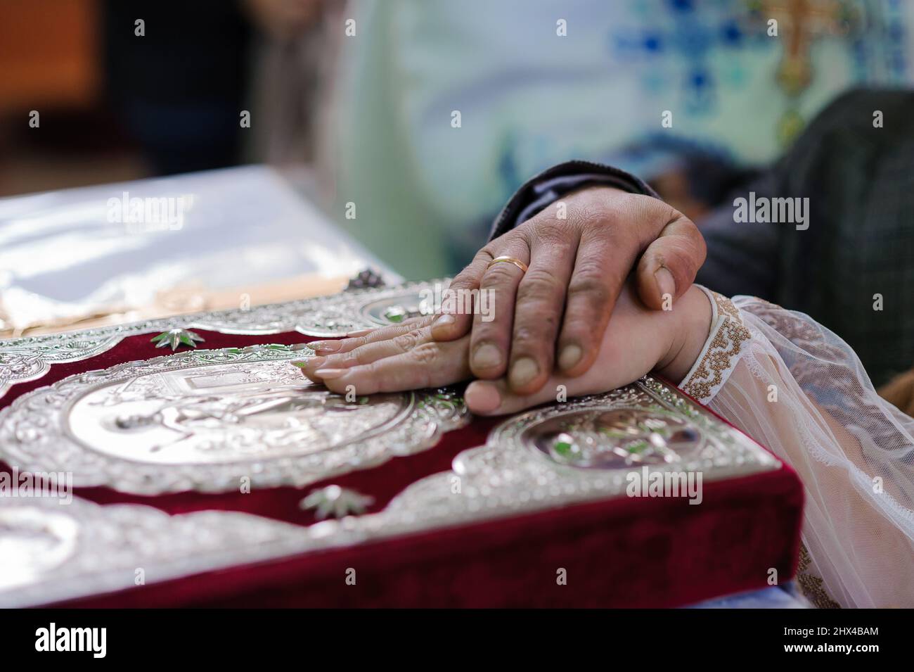 Wedding ceremony in the church. Hands of the bride and groom Stock ...