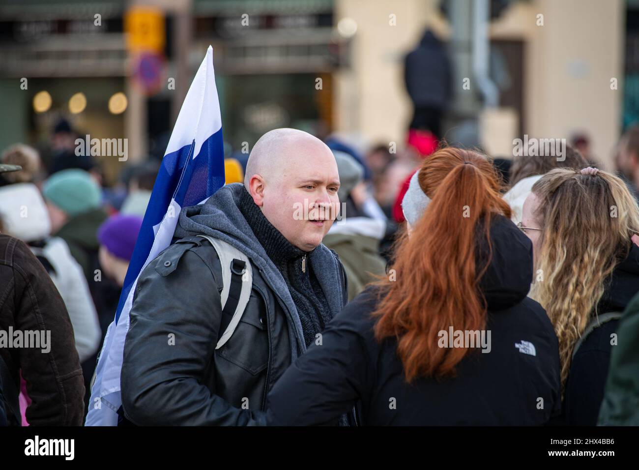 Bald man with flag of Finland on Market Square after men's hockey team ...