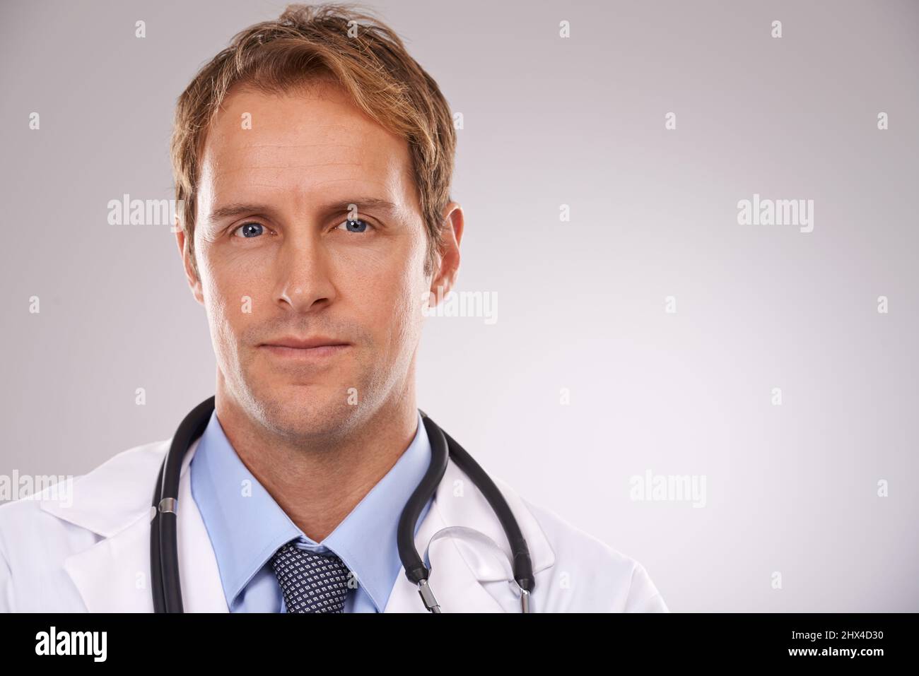 Hes a fantastic physician. Cropped studio portrait of a confident young ...
