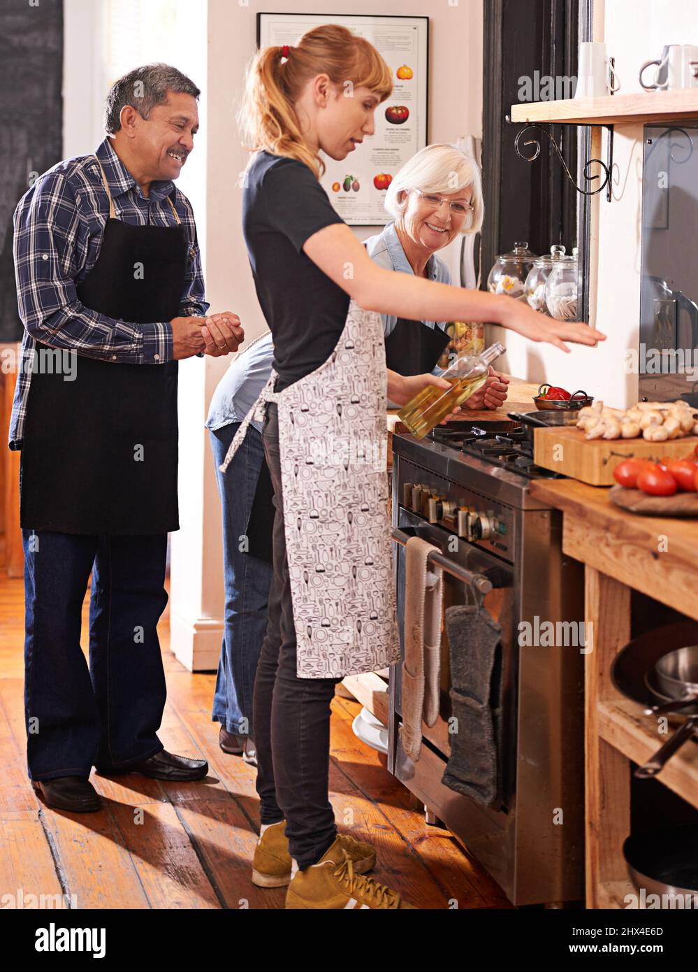 Woman cooking at stove hi-res stock photography and images - Alamy