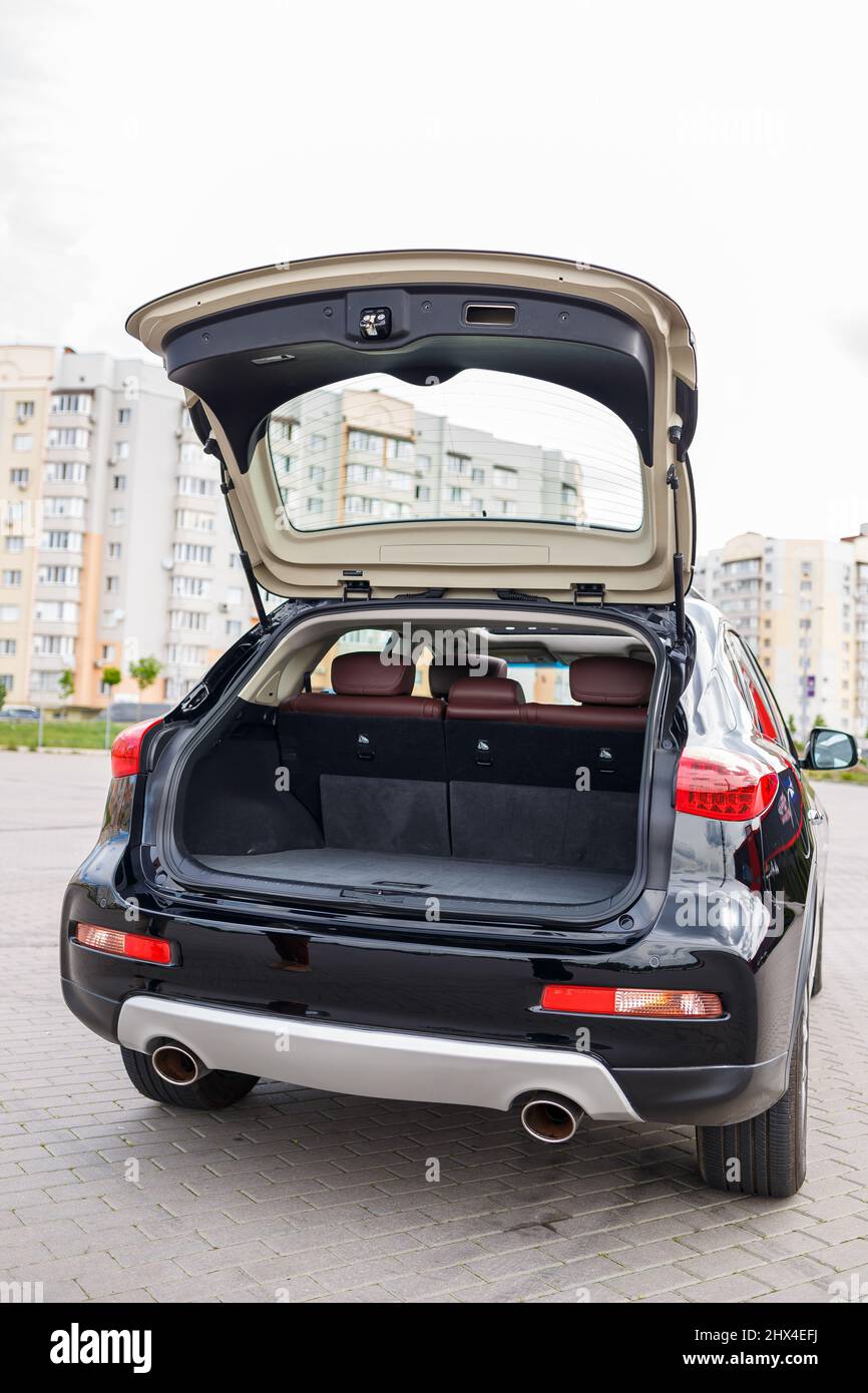 Modern black car, black SUV jeep on big wheels. Rear view of open car ...