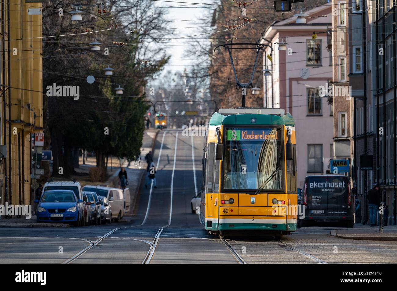 Tram on Nygatan in the city center of Norrkoping, Sweden. The yellow ...